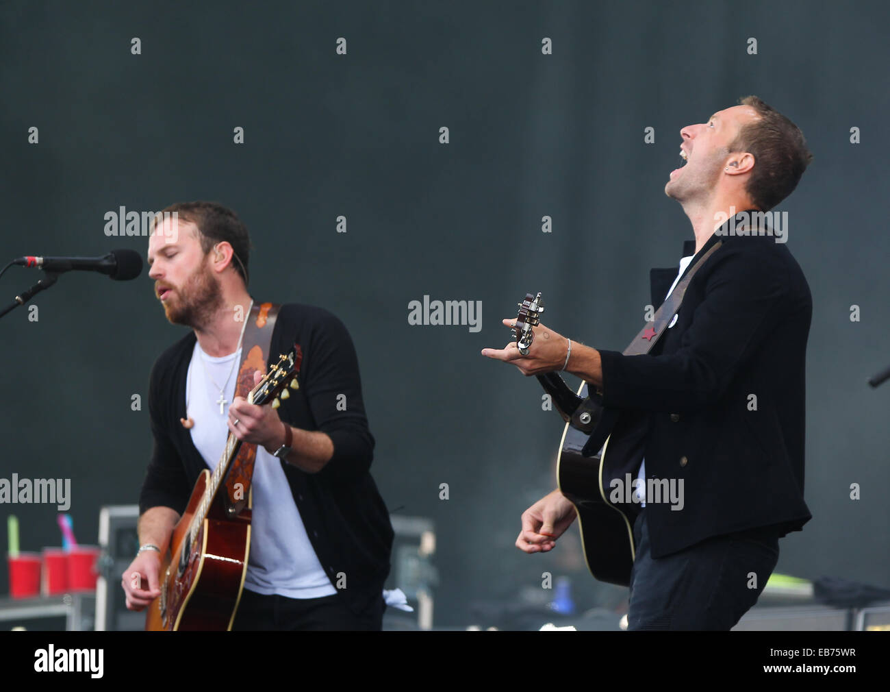 Chris Martin of Coldplay joins Kings Of Leon on stage during their set ...