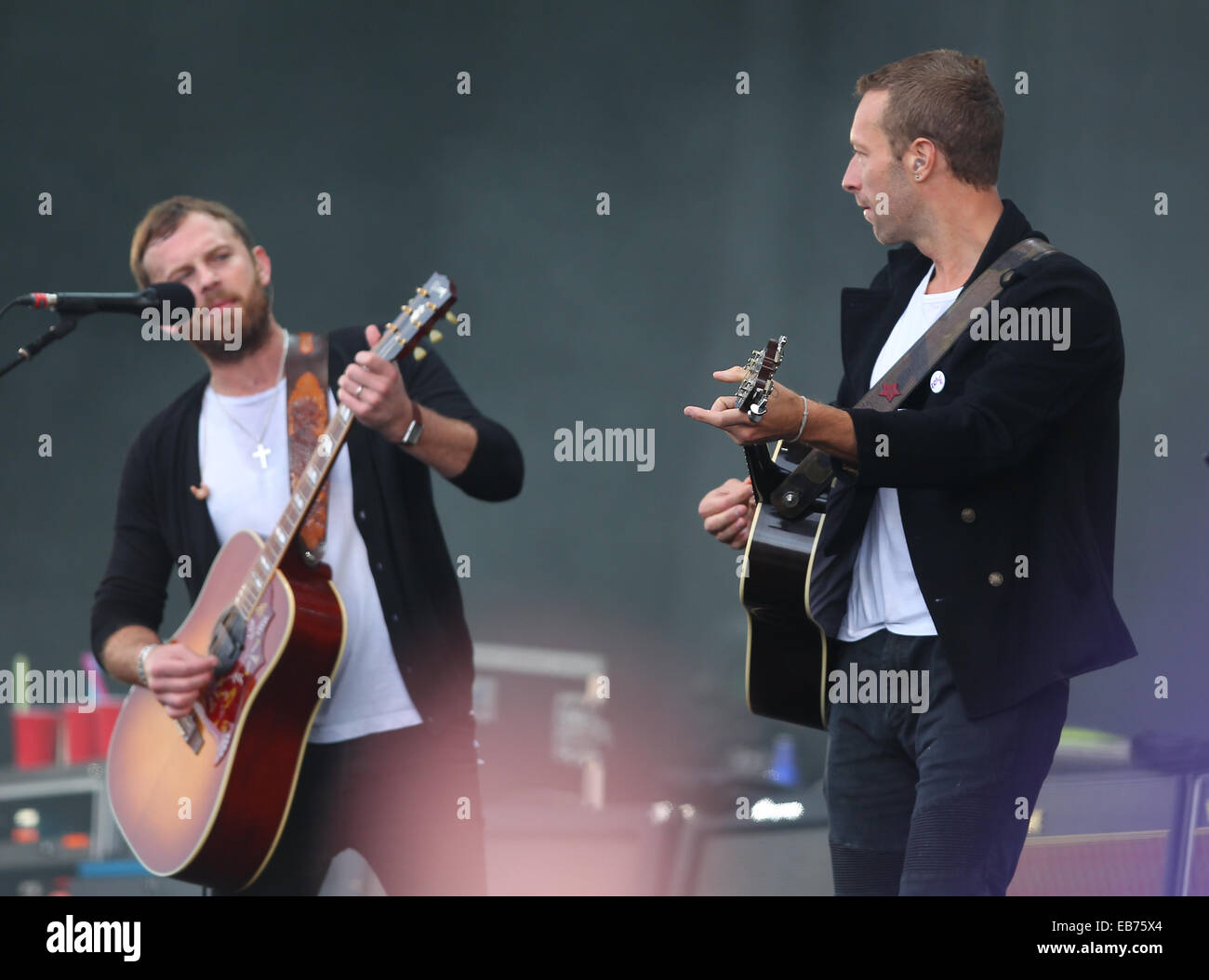 Chris Martin of Coldplay joins Kings Of Leon on stage during their set ...