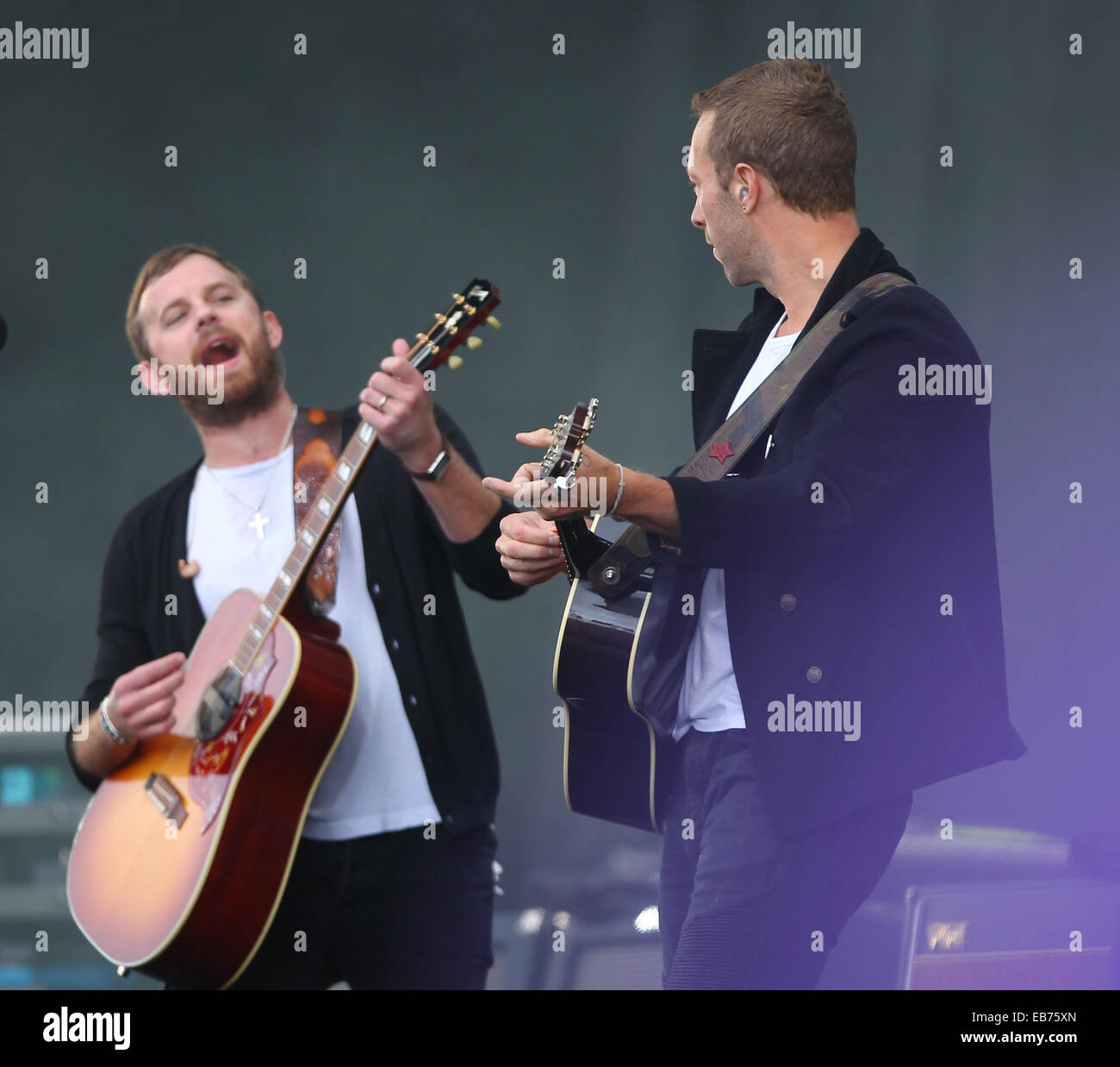 Chris Martin of Coldplay joins Kings Of Leon on stage during their set ...