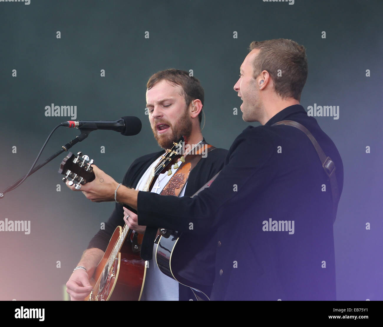 Chris Martin of Coldplay joins Kings Of Leon on stage during their set ...