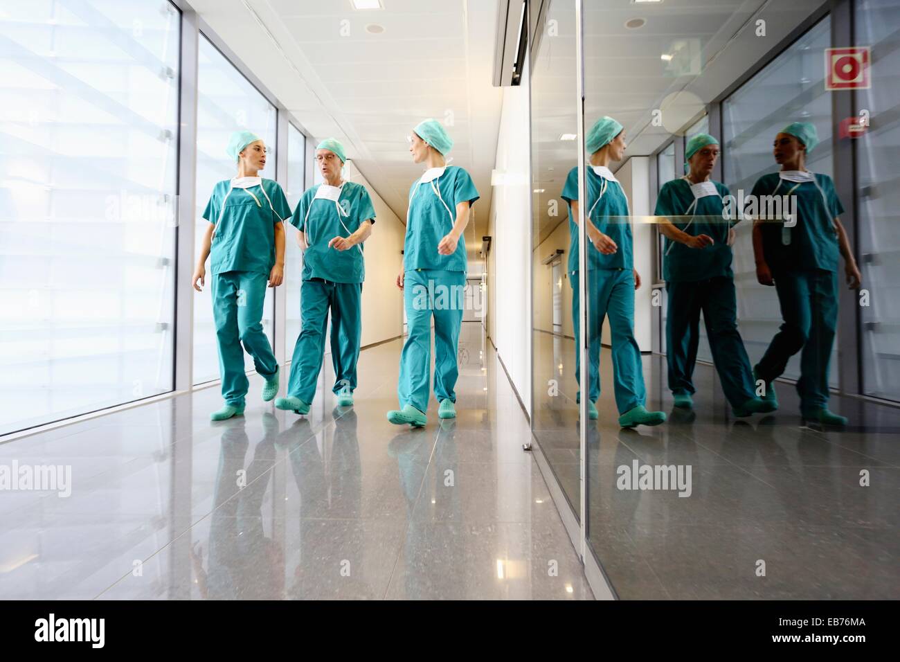 surgeons walking in the operating room hallway Onkologikoa Hospital ...