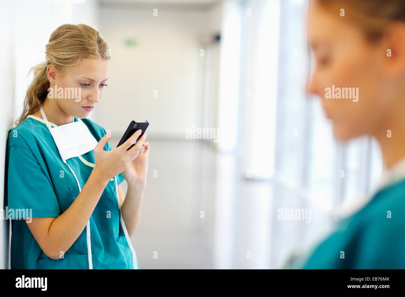 surgeon with smartphone in the operating room hallway Onkologikoa ...