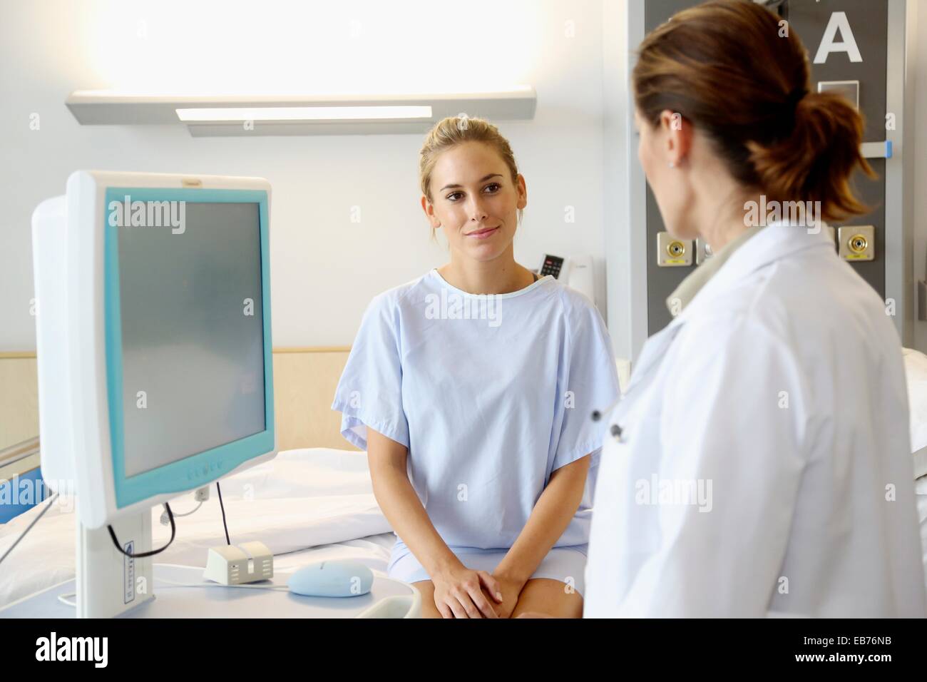 Patient attending to senior hospital hi-res stock photography and ...