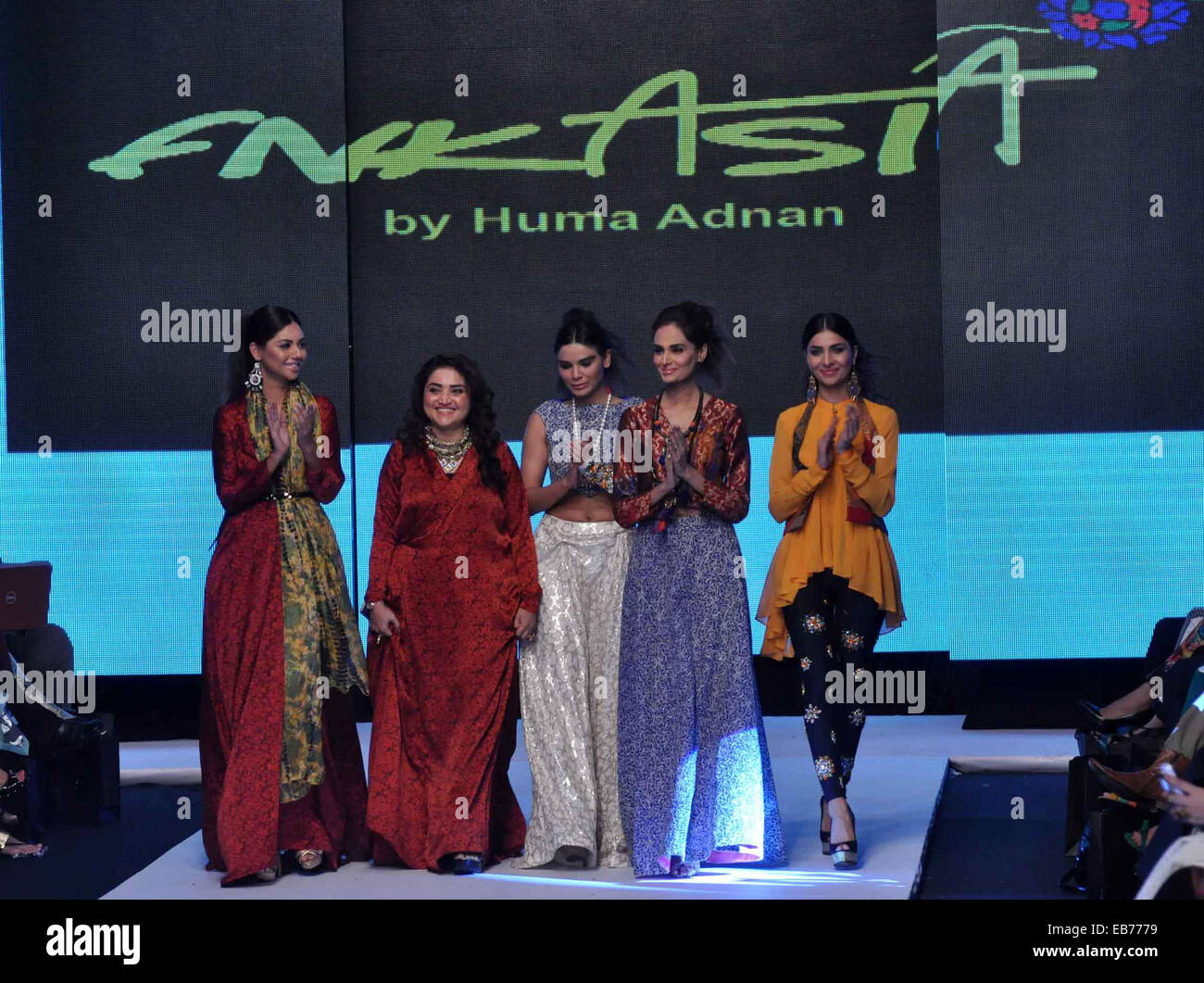 Karachi, Pakistan. 26th Nov, 2014. Models present creations by fashion ...