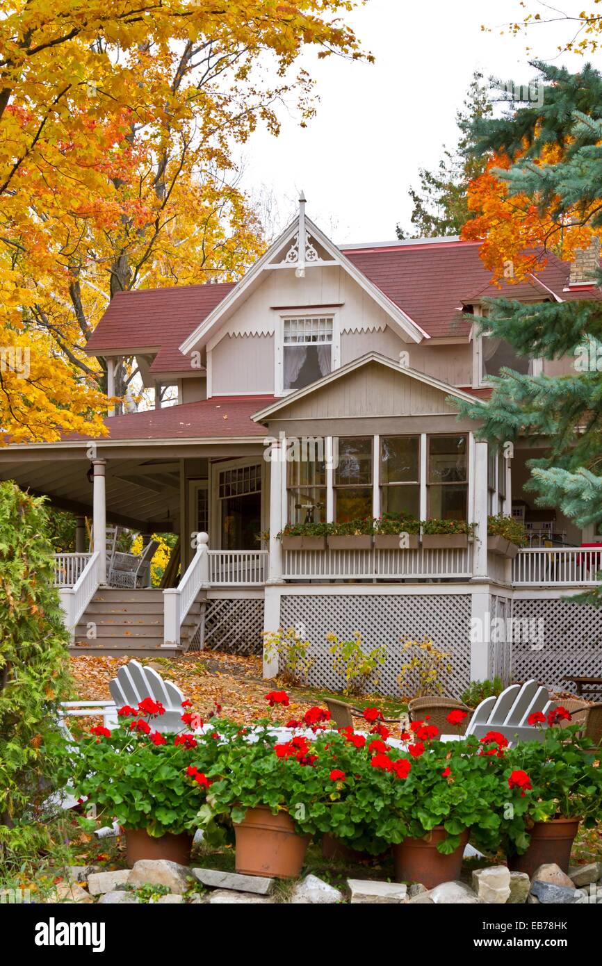 A Colonial home with fall foliage color in Petoskey, Michigan, USA ...