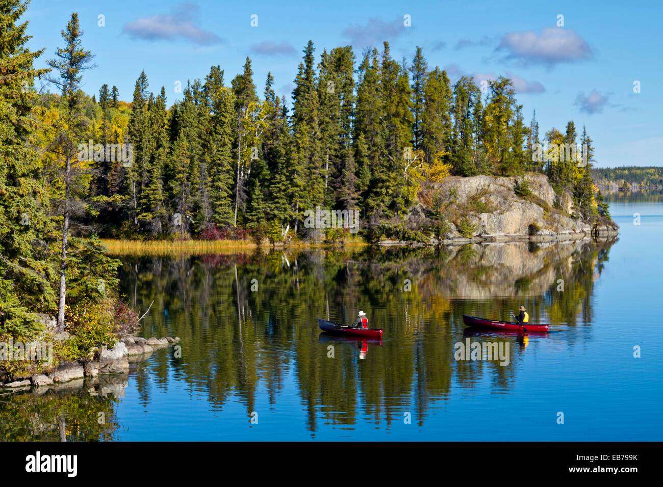 A northern Manitoba landscape of fall foliage color and reflections ...