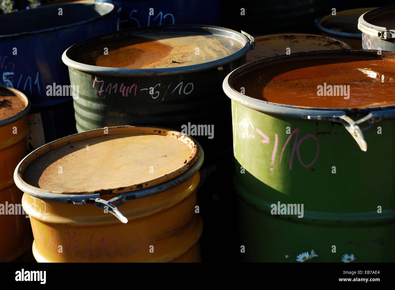 old rusty barrels of fruit syrup Stock Photo - Alamy