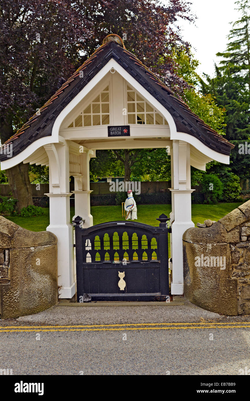 Lich Gate and cricketer scarecrow in Ashford-in-the-Water near Bakewell ...