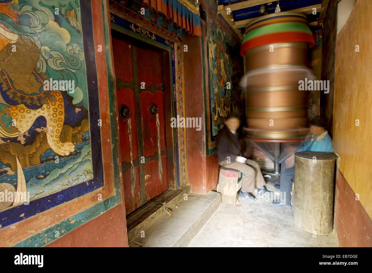 two tibetan old man pray nearby big pray wheel temple the triad ...