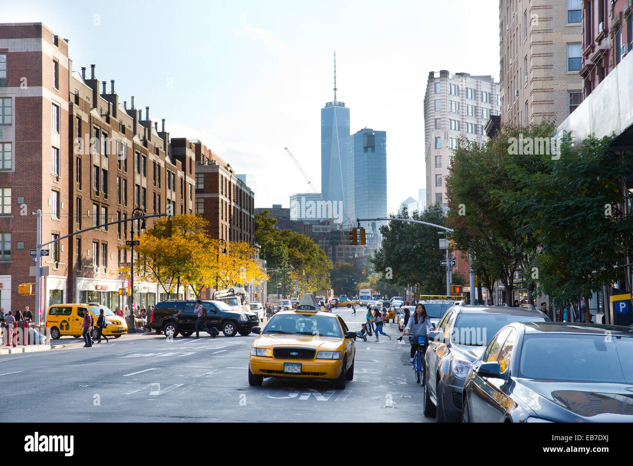 Street scene ( 6th Ave ) with One World Trade Center in the back ...