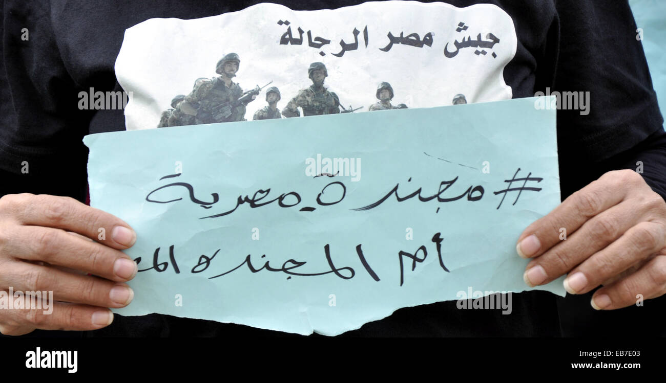 Cairo, Egypt. 27th Nov, 2014. Egyptian female students hold banners ...