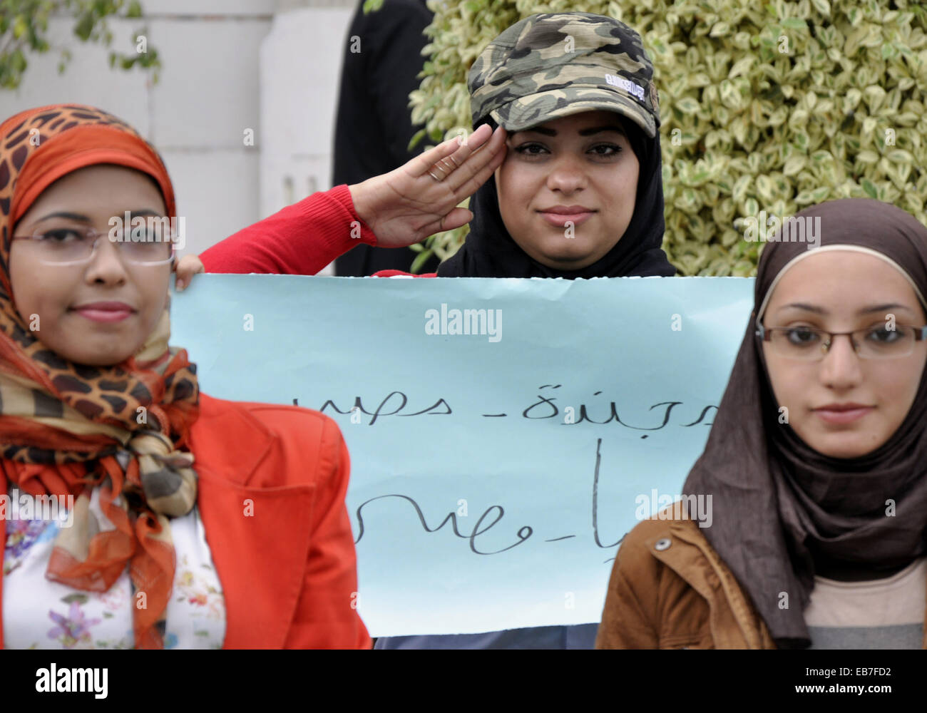 Cairo, Egypt. 27th Nov, 2014. Egyptian female students hold banners ...