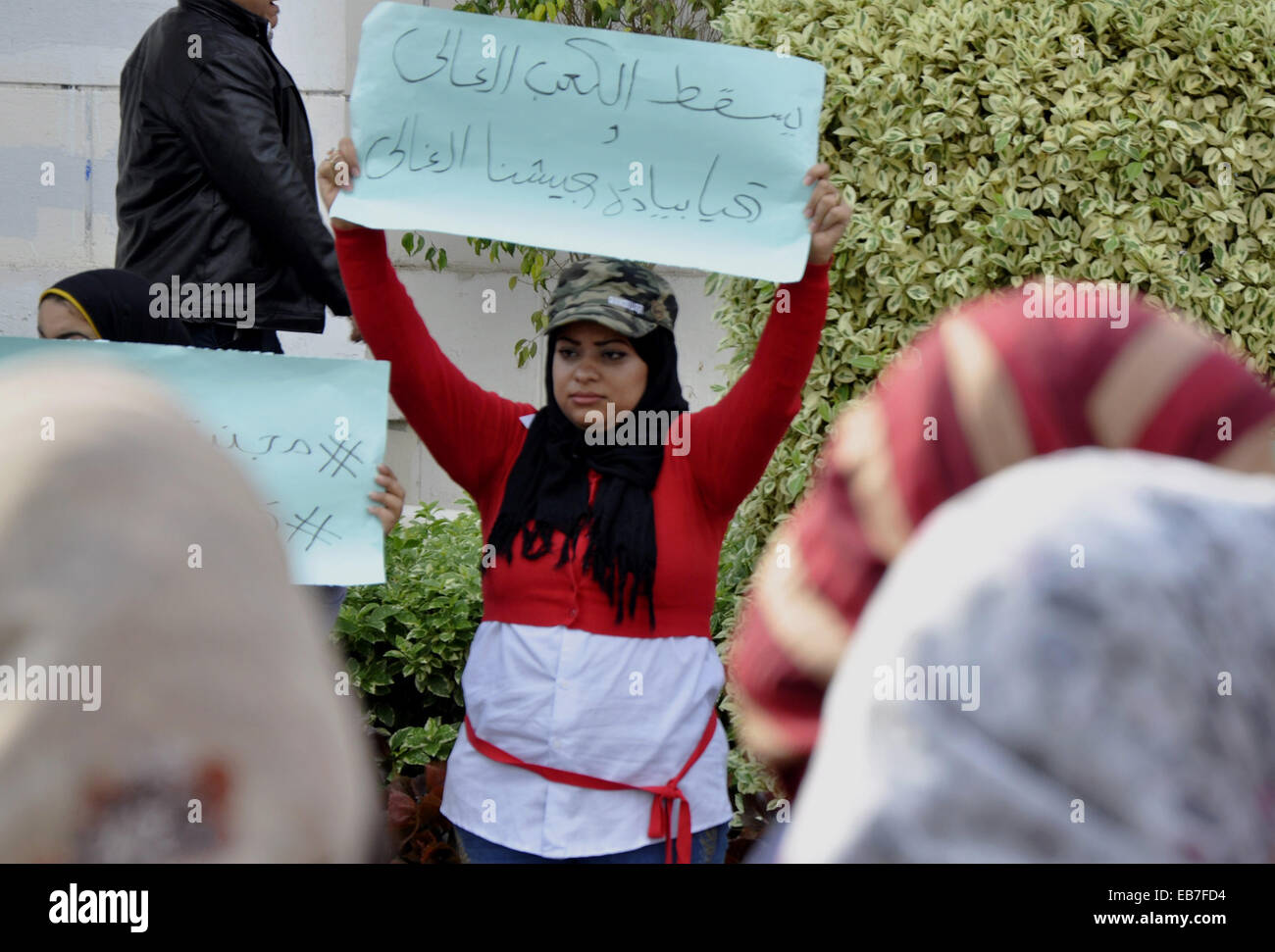 Cairo, Egypt. 27th Nov, 2014. Egyptian female students hold banners ...