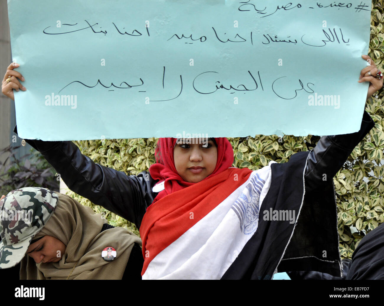 Cairo, Egypt. 27th Nov, 2014. Egyptian female students hold banners ...