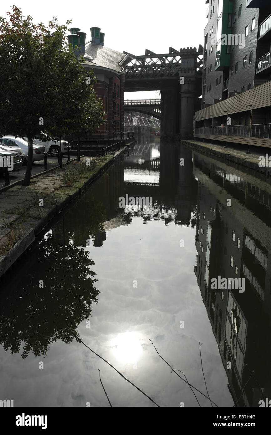 Portrait sun and hotel building reflecting arm Castlefield Canal Basin ...