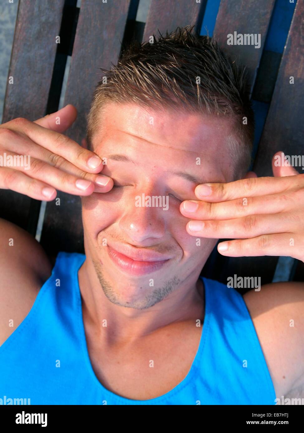 Man awakening on a bench Stock Photo - Alamy
