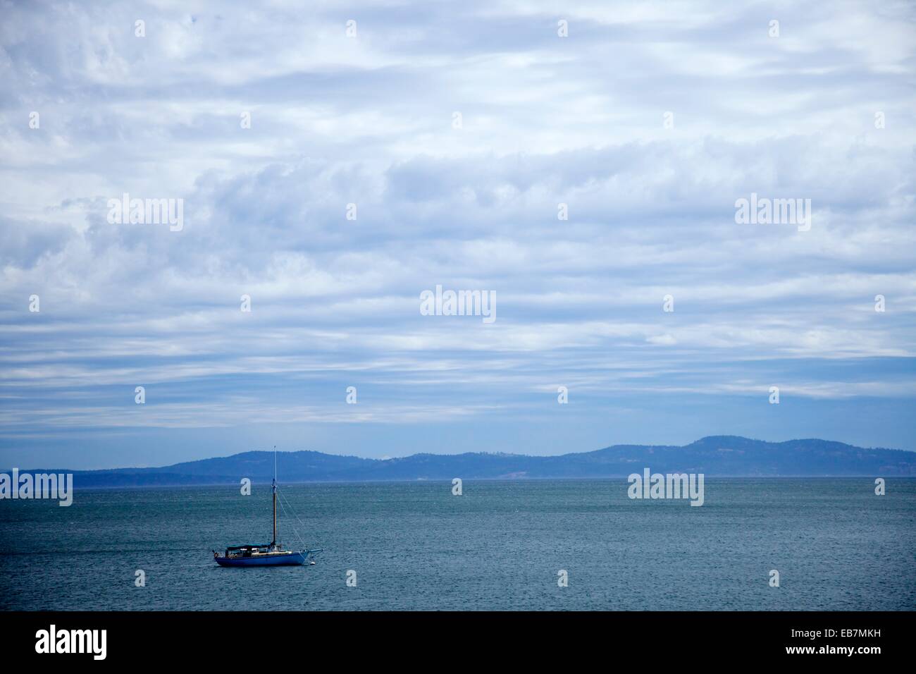 A sailboat at anchor off Comox bay Stock Photo - Alamy