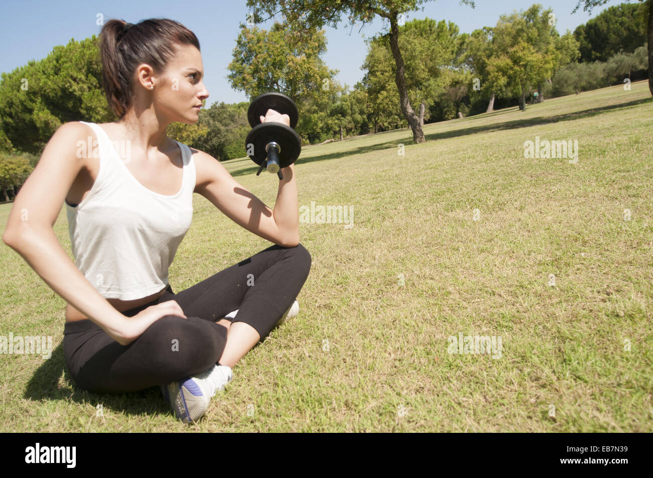 girl doing sports in a park Stock Photo - Alamy