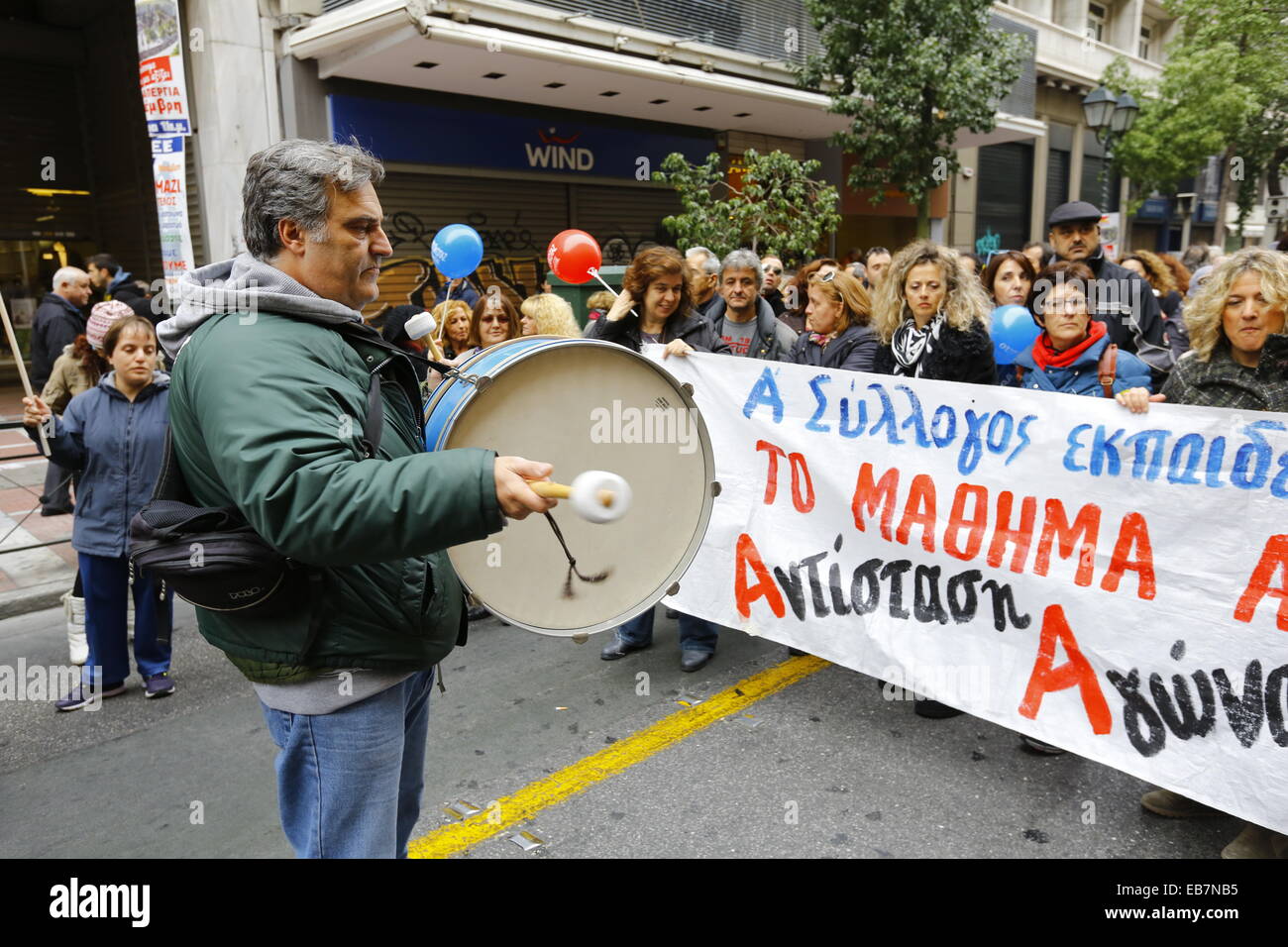 Athens, Greece. 27th November 2014. A protestor beats a drum at the the ...