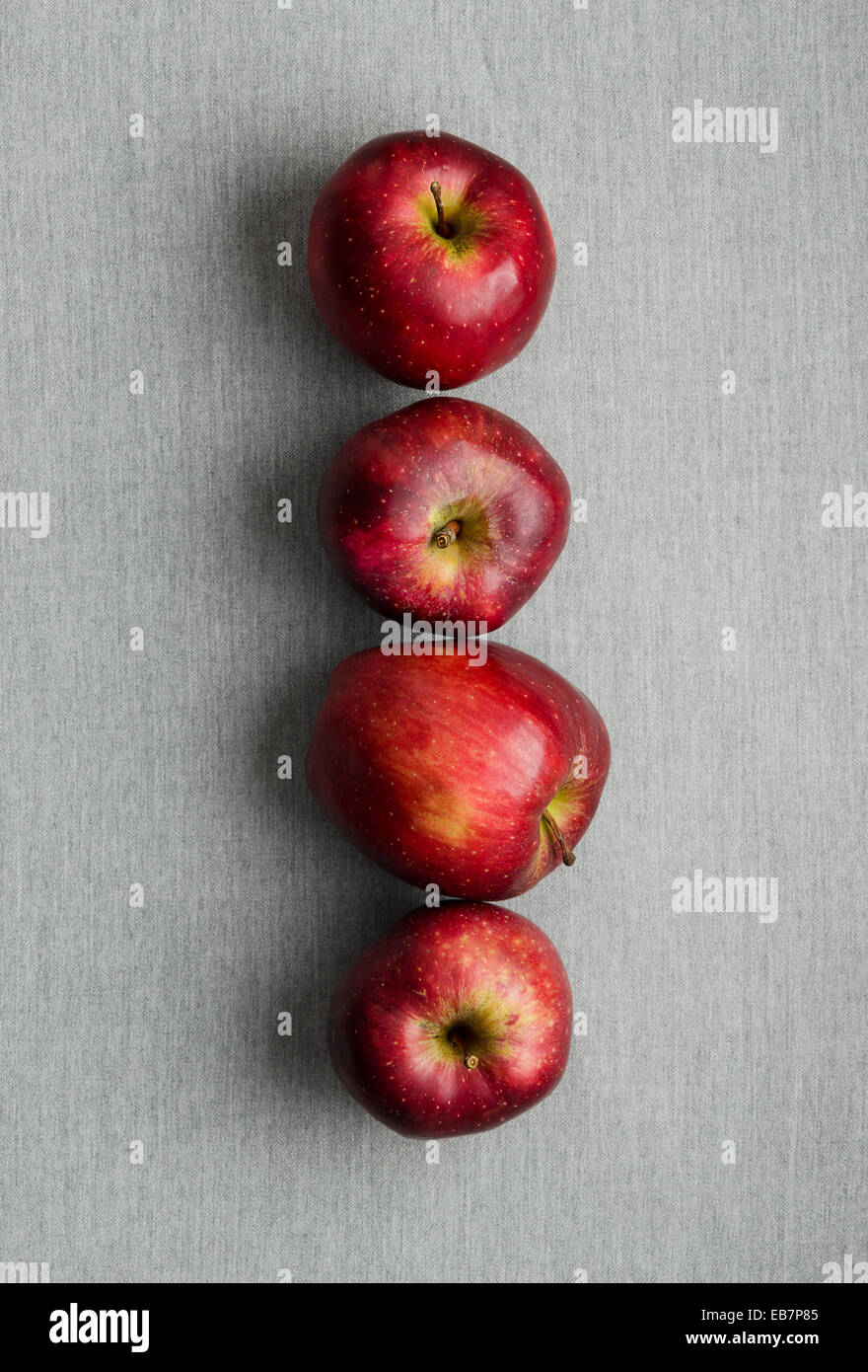 Ripe red apples in a row over gray cloth, above view Stock Photo - Alamy