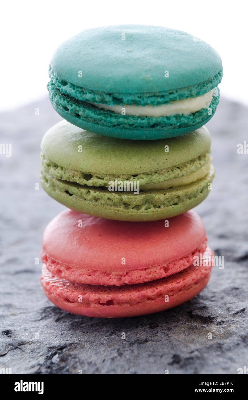 Stack of macaroons biscuits over gray stone texture Stock Photo - Alamy