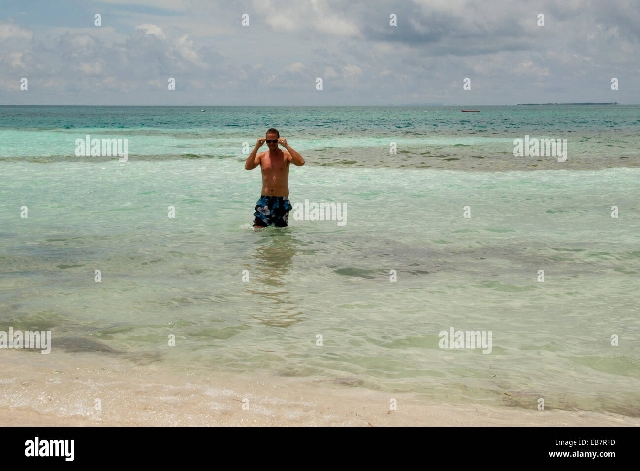 Young man in the sea Stock Photo - Alamy