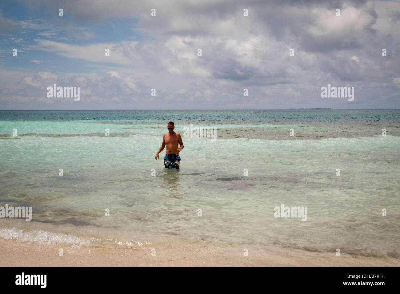 Young man in the sea Stock Photo - Alamy
