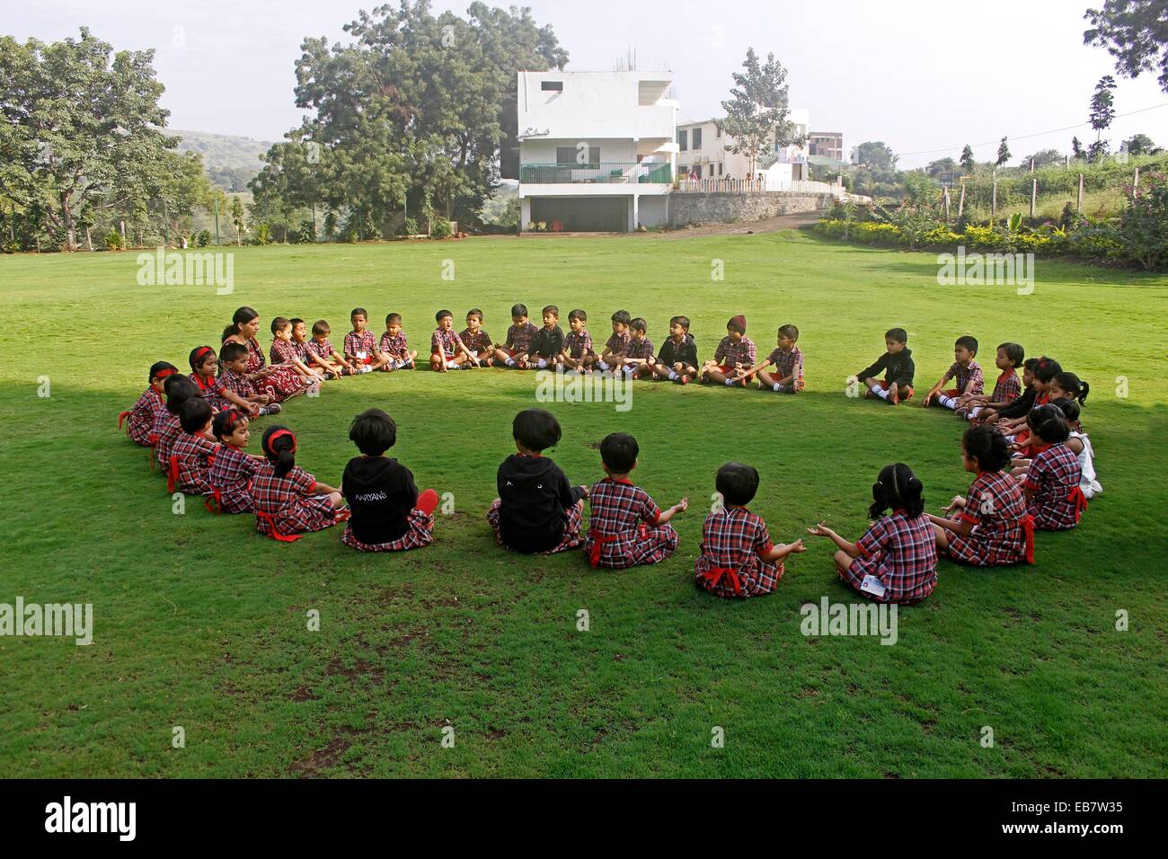 Pre Primary Students doing Exercise on Ground, India Stock Photo - Alamy