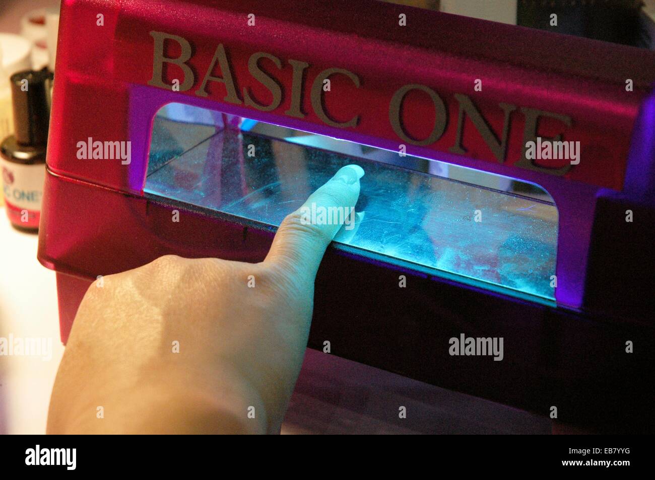 New York City, a woman drying hue in a special machine during the ...