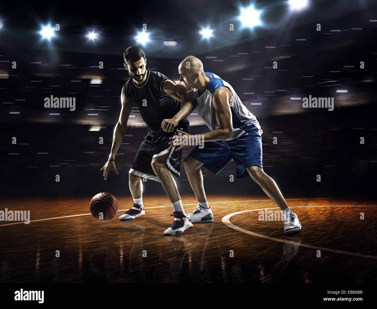 Two basketball players in action Stock Photo - Alamy