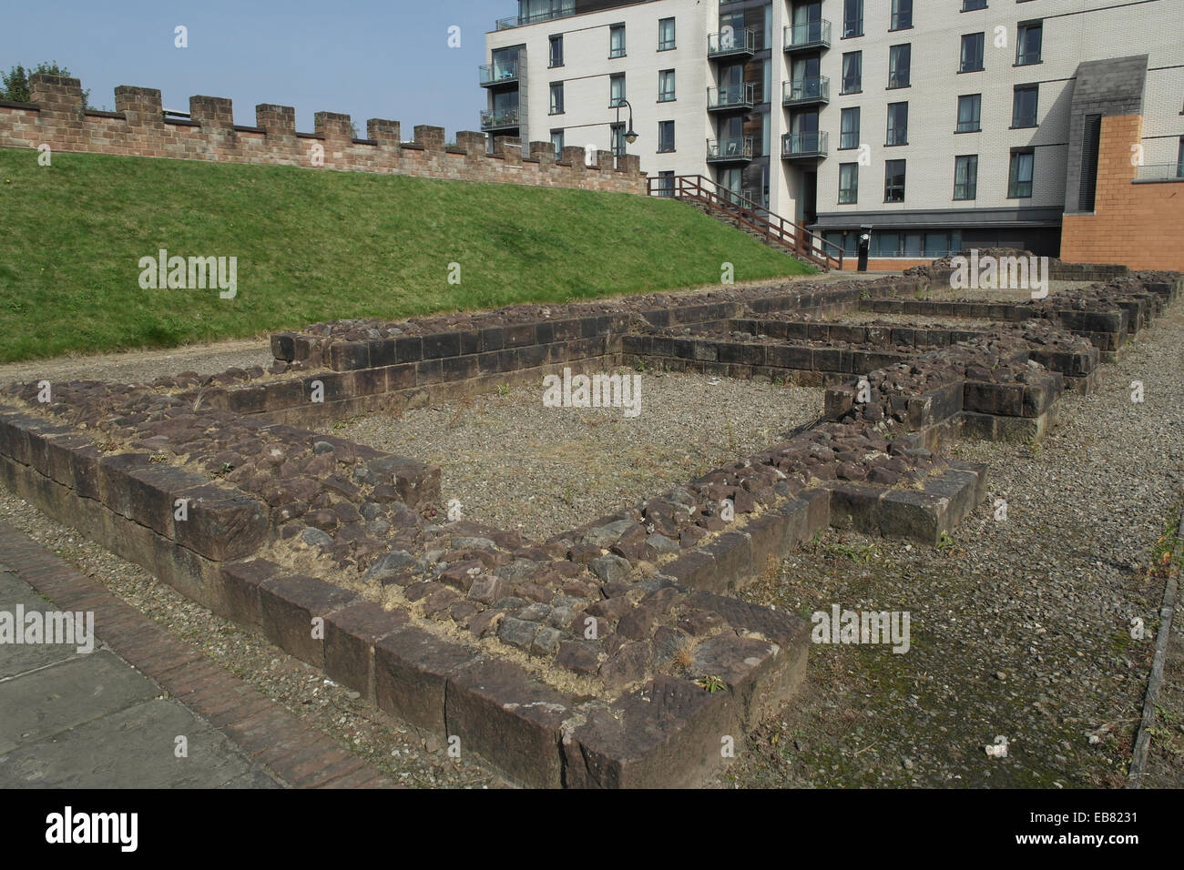 Blue sky view green rampart with stone wall above foundations granary ...