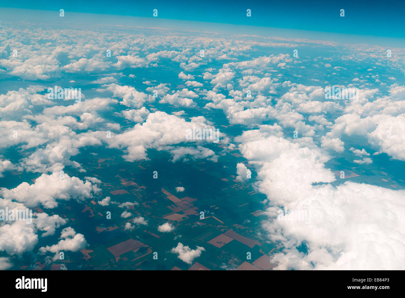 View of land, fields, and clouds from above Stock Photo - Alamy