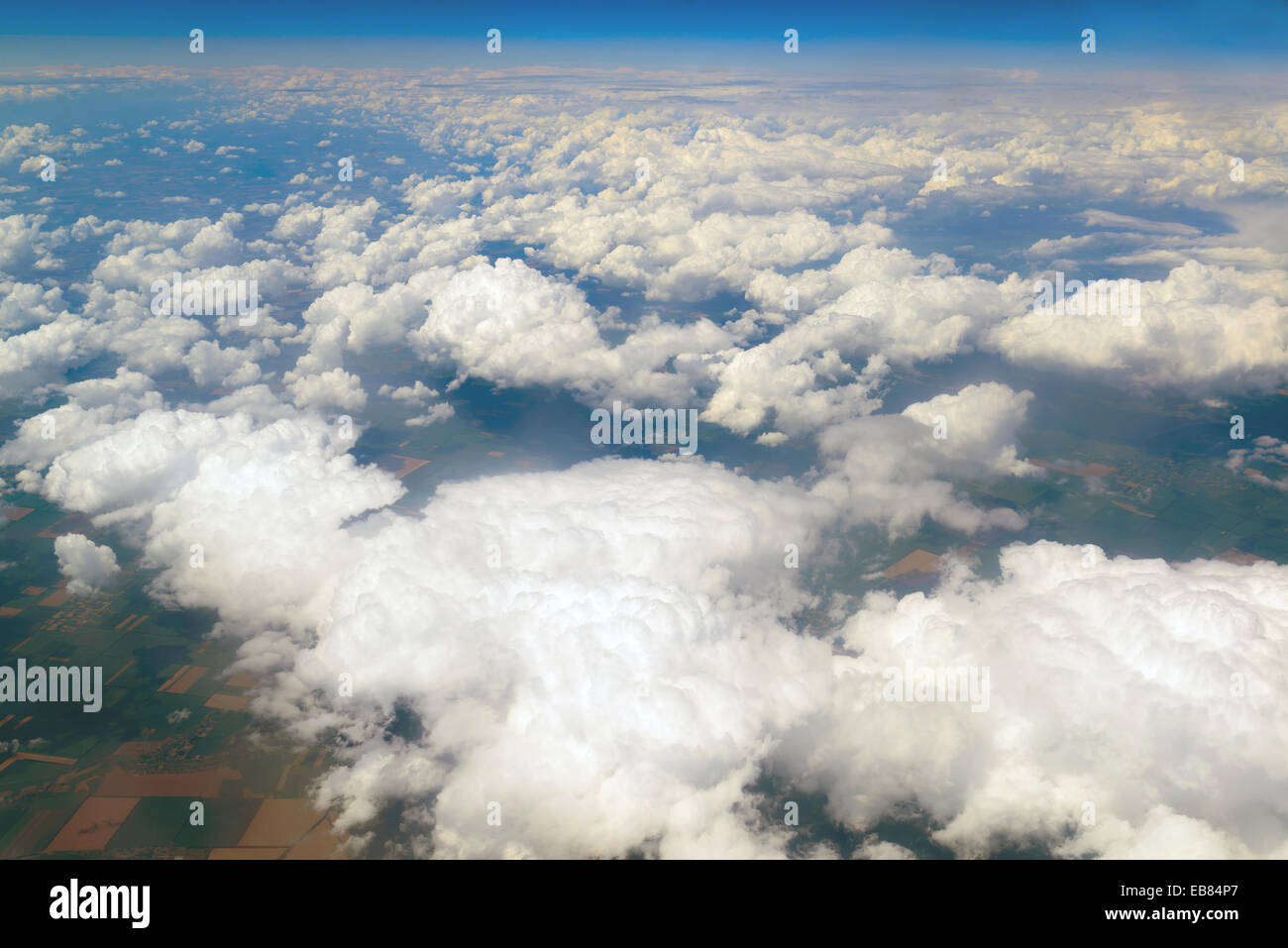 View of land, fields, and clouds from above Stock Photo - Alamy