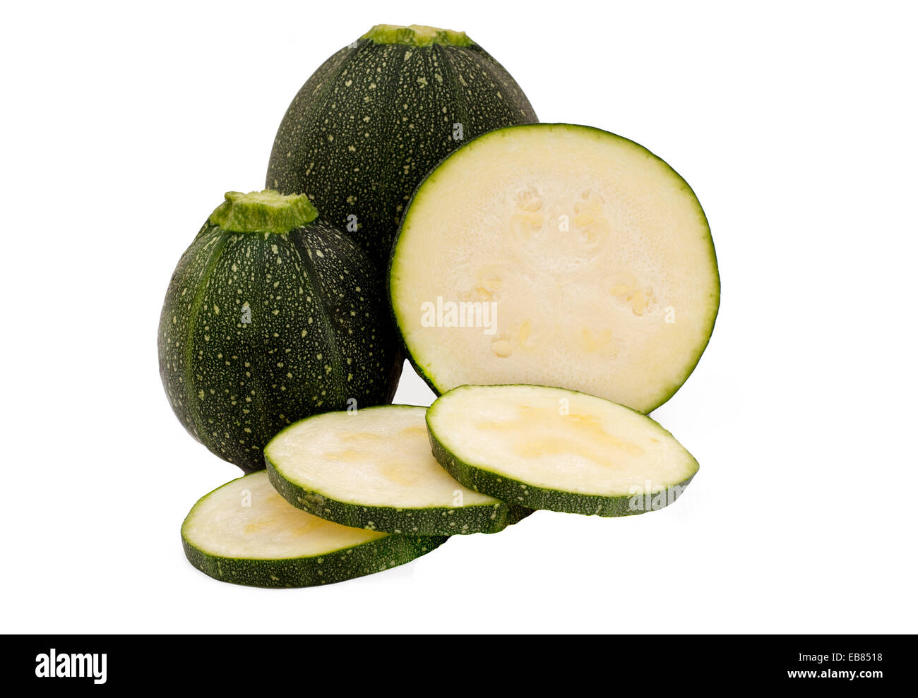 Round Courgettes isolated on a white background showing whole and ...