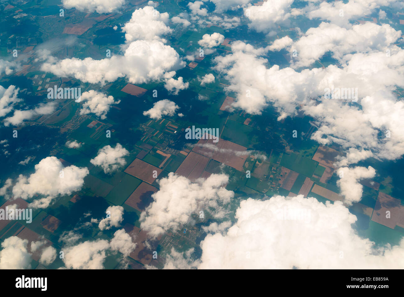 View of land, fields, and clouds from above Stock Photo - Alamy
