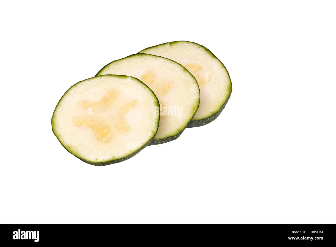 Sliced Courgettes isolated on a white background Stock Photo - Alamy