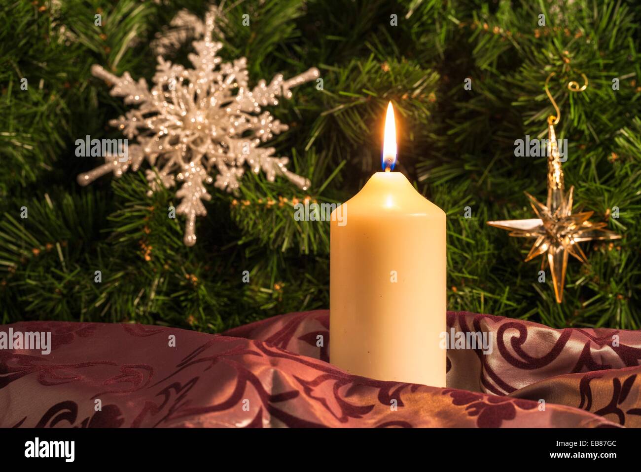 Lit candle and decoration at christmas season Stock Photo - Alamy