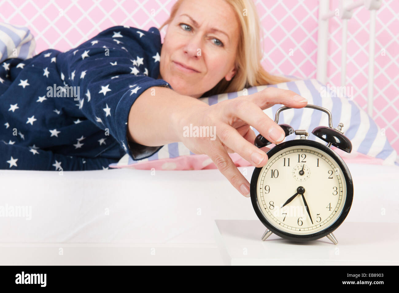 Old woman with alarm clock hi-res stock photography and images - Alamy