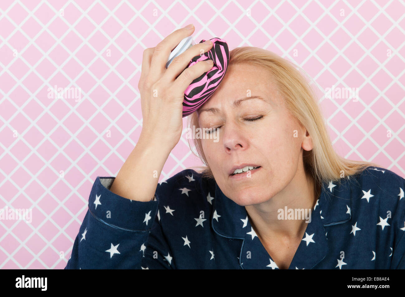 Woman with cool bag for headache Stock Photo - Alamy