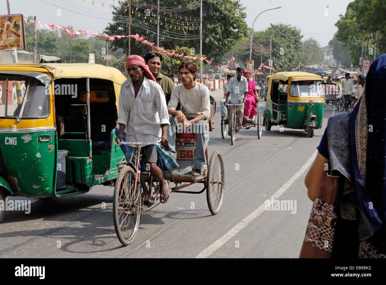 Rickshaws in a street of delhi hi-res stock photography and images - Alamy