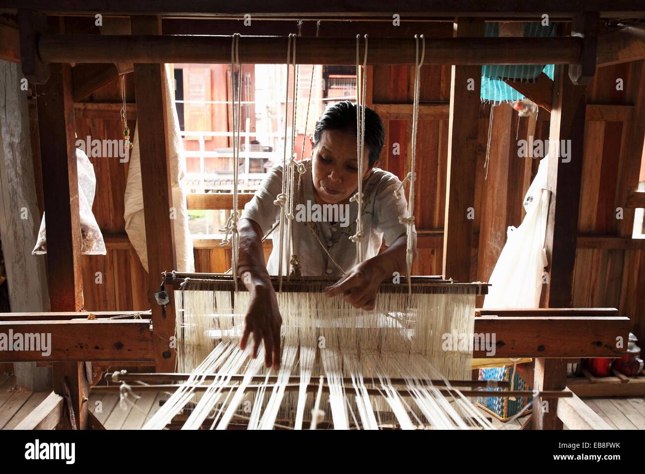 Weaver weaving in a weaving mill, Inle Lake, Shan state, Myanmar, Burma ...