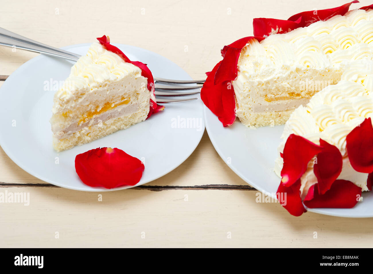 whipped cream mango cake with red rose petals Stock Photo - Alamy