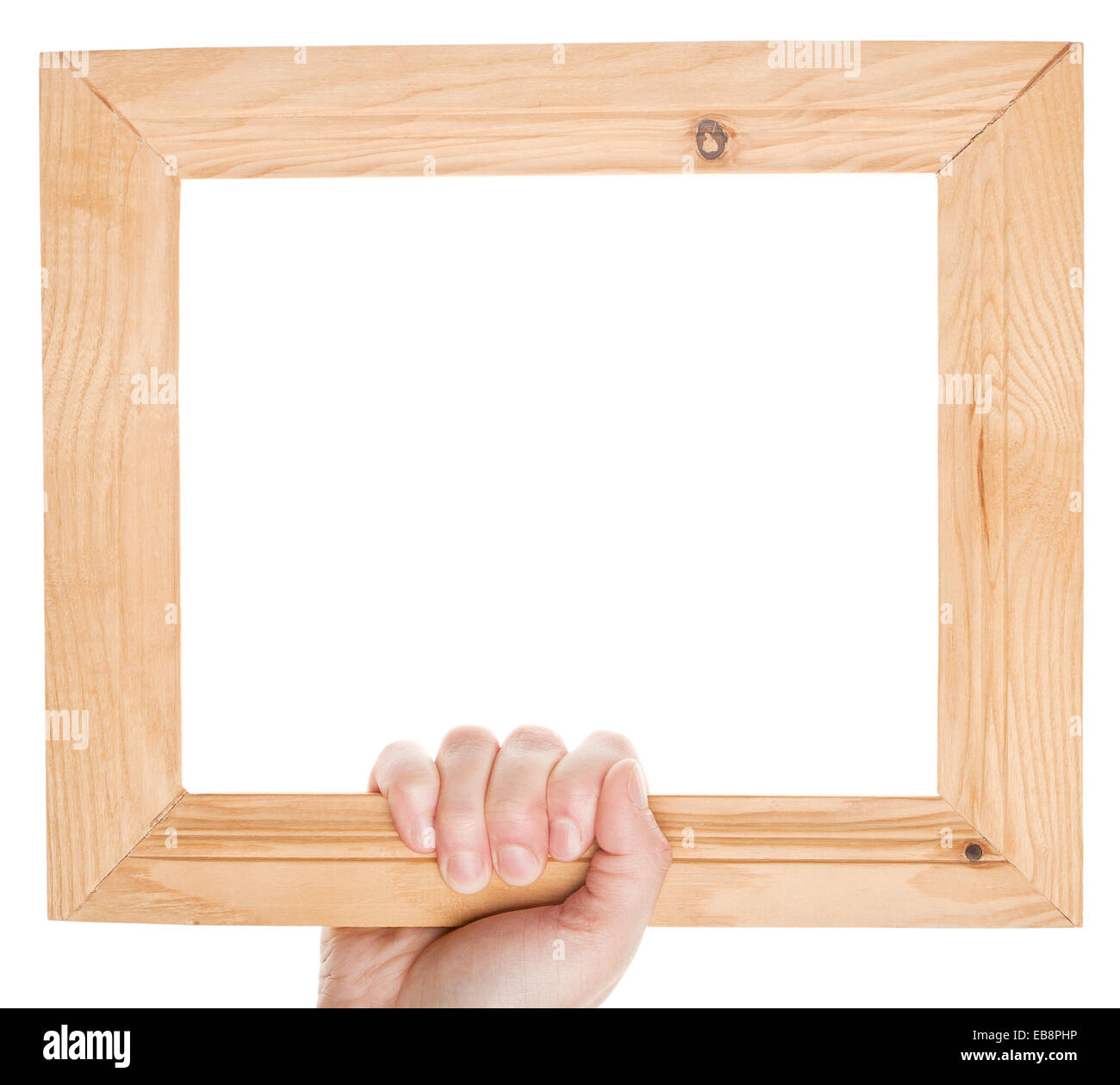 Wooden frame in hand isolated on white background Stock Photo - Alamy