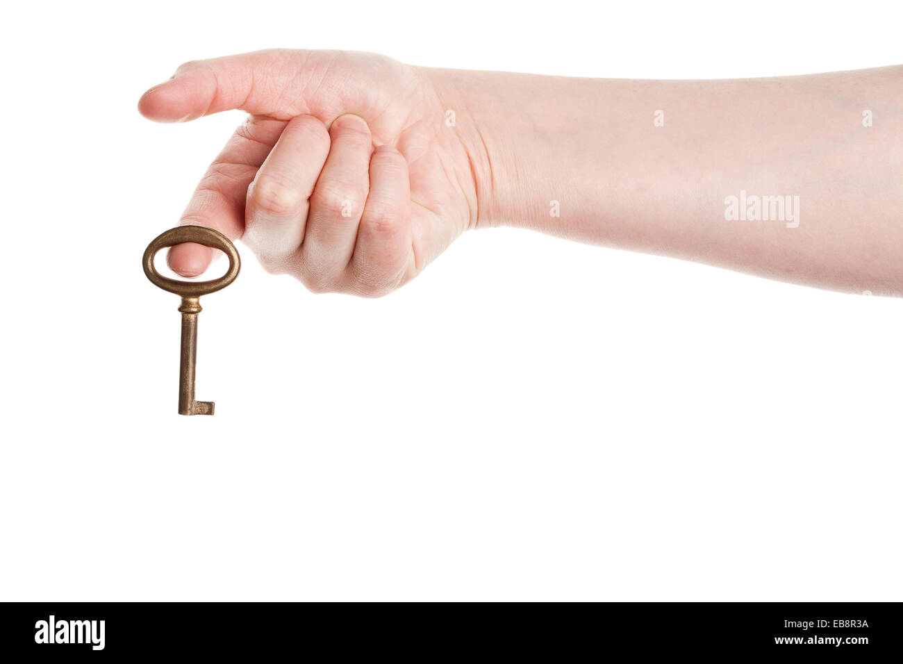 Hand holding old key isolated on white background Stock Photo - Alamy