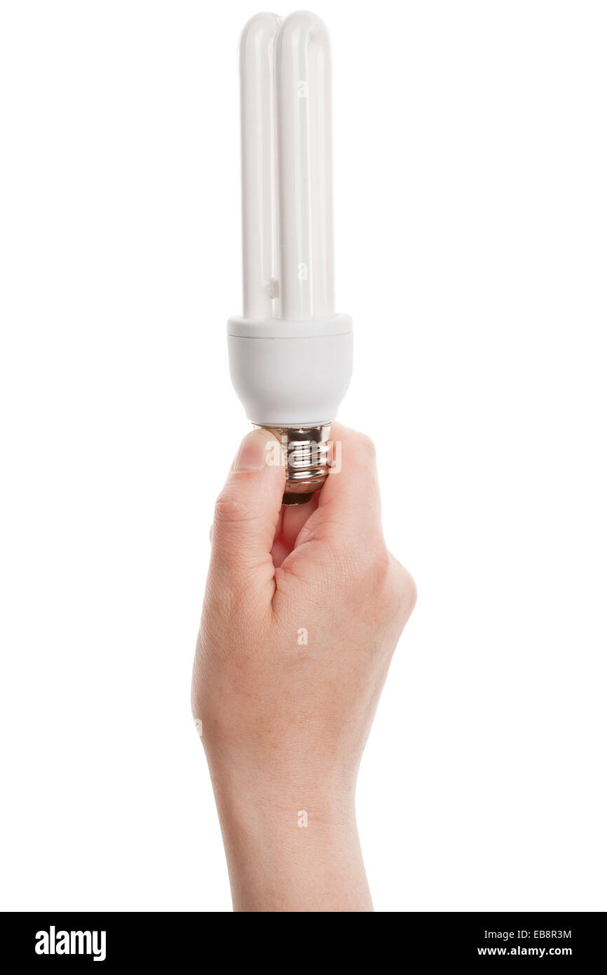 Hand holding energy saving fluorescent light bulb isolated on white ...