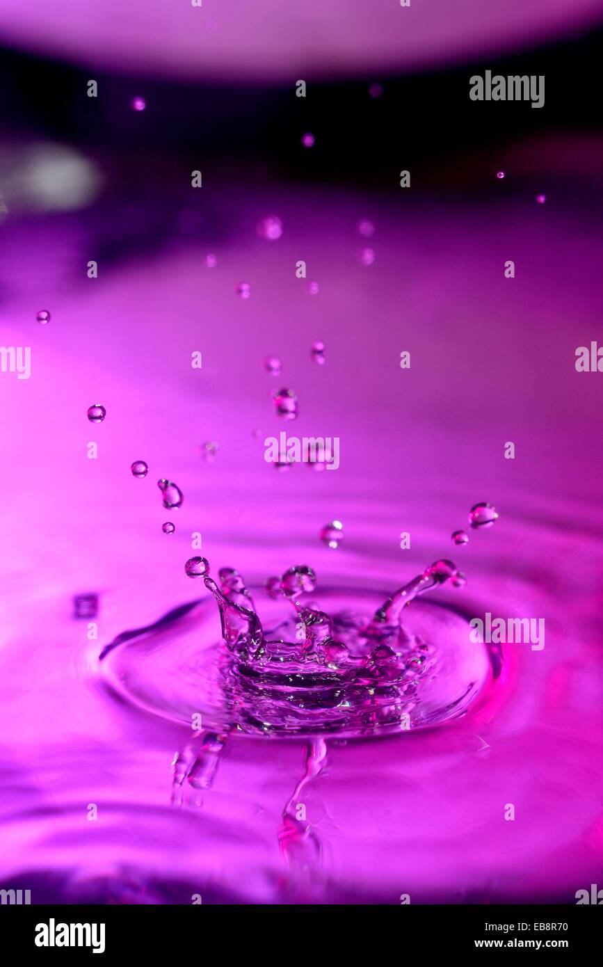High-speed photograph of a water drop impacting on water showing ...