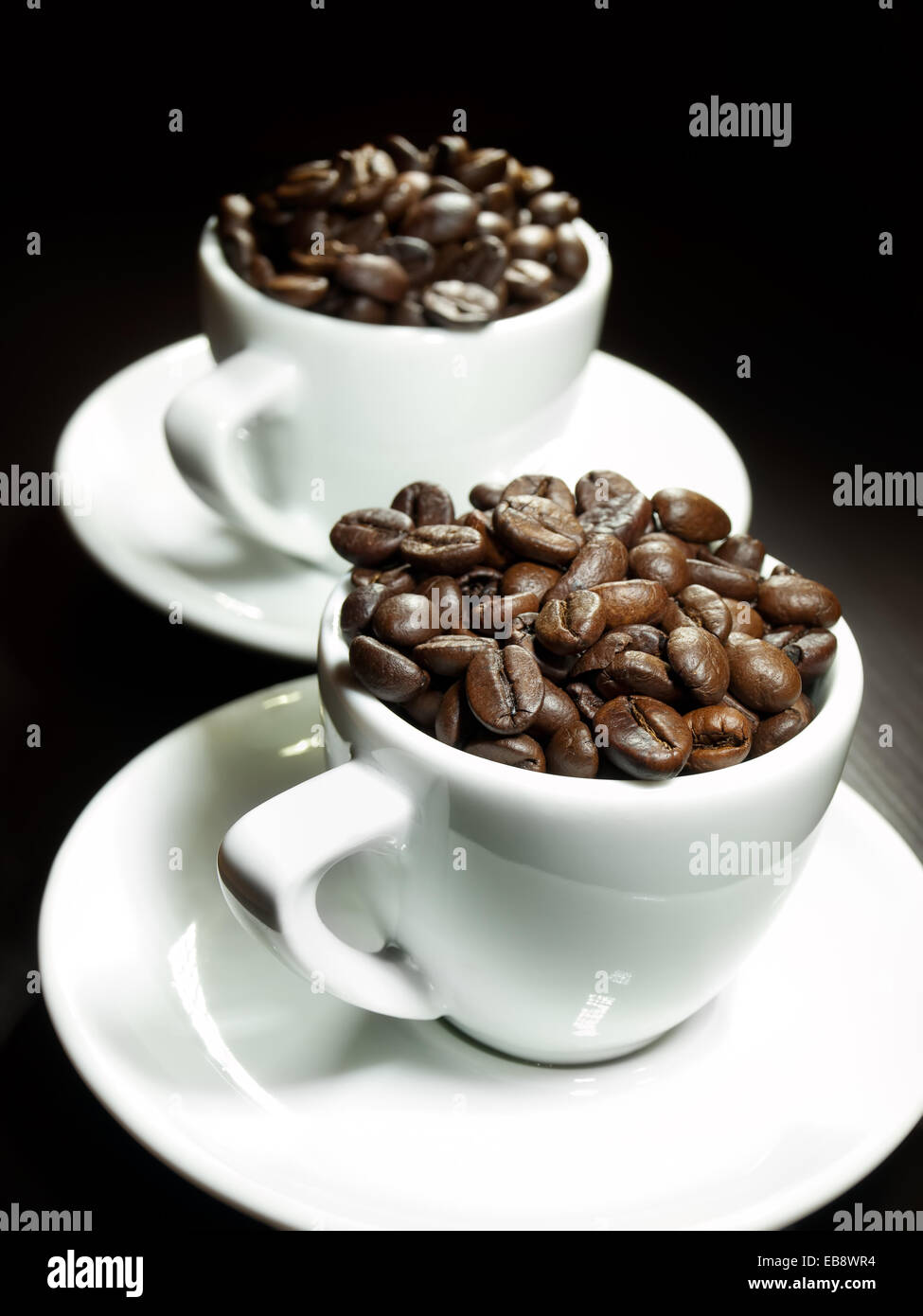 Two cups full of coffee beans Stock Photo - Alamy