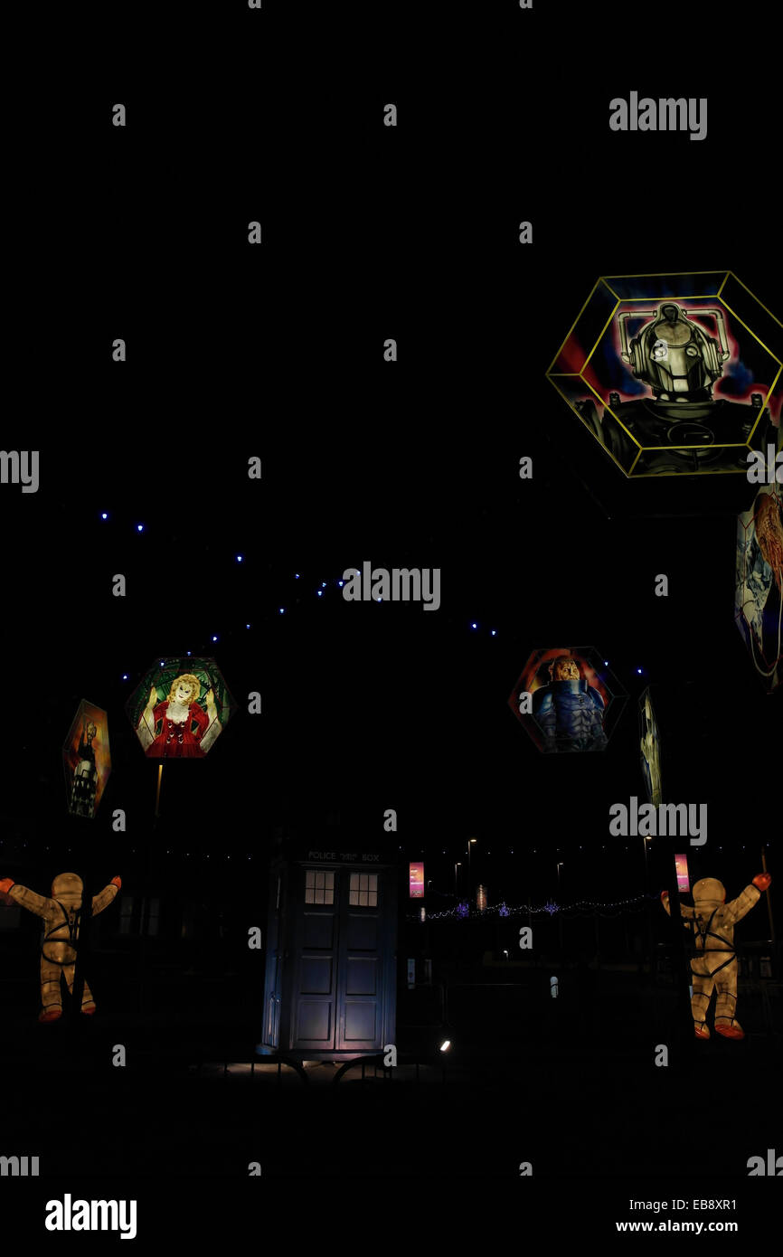 Night portrait illuminated astronauts and blue Tardis below Dr Who ...