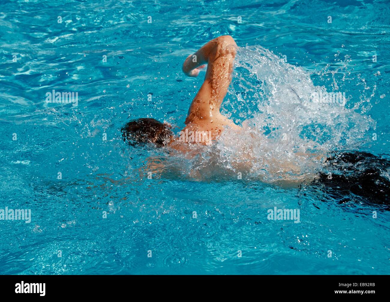 young man swimming crawl in swimming pool Stock Photo - Alamy