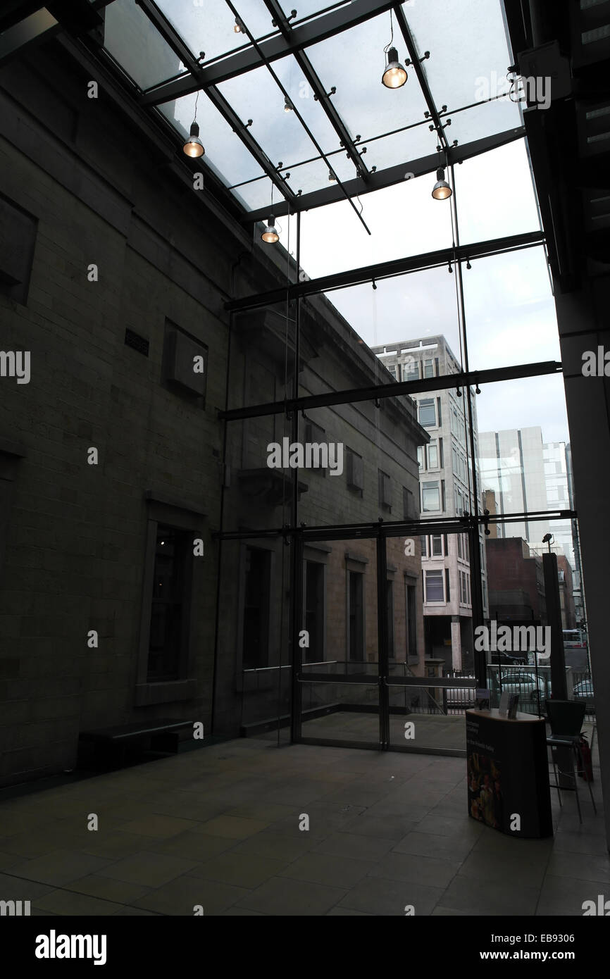 Portrait glazed atrium linking old and new buildings at the Manchester ...